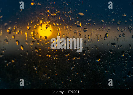 Unfocuced sun and water drops on the window Stock Photo - Alamy