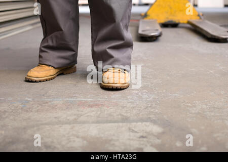 Shoes, legs and man in warehouse, walking and logistics with inventory ...