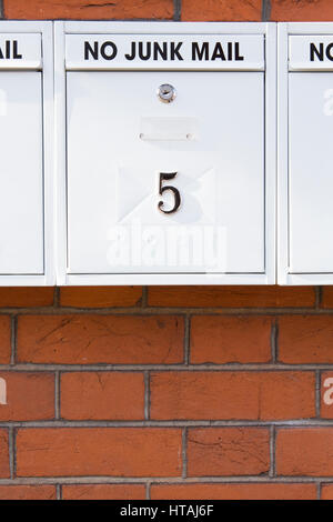 Line Of Mailboxes With No Junk Mail Notice Stock Photo - Alamy