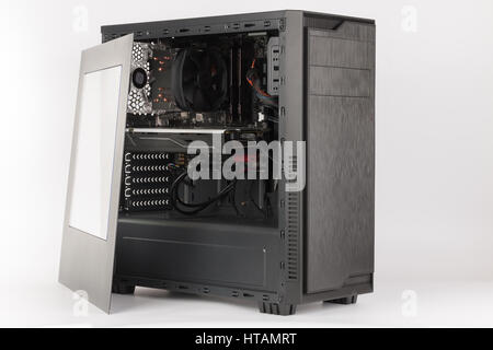 Black open desktop computer side view with motherboard visible. PC ...