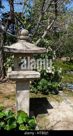 Traditional East Asian stone (Toro) lanterns in the garden Stock Photo ...