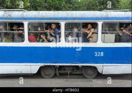 North Korea, Pyongyang, trolley bus full of passengers Stock Photo ...