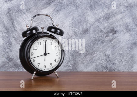 12 o'clock of retro vintage clock with red heart and sun light morning ...