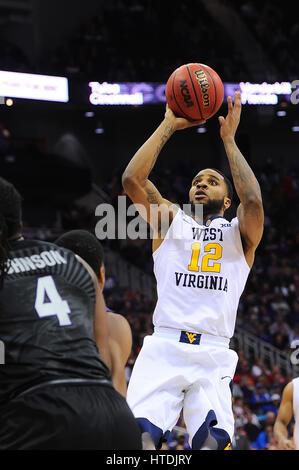 West Virginia guard Tarik Phillip (12) dribbles inside as TCU guard ...