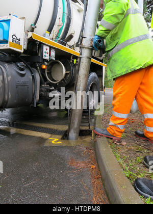 Drainage clearance team and gully tanker Stock Photo - Alamy