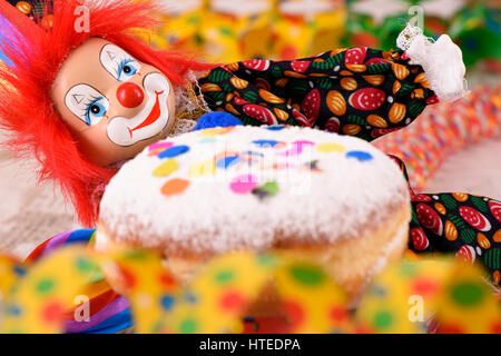 clown with red hairs and sweet donut at carnival Stock Photo - Alamy