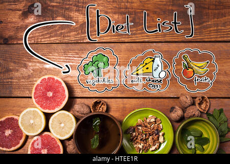 Lemon and walnut on a wooden surface close up Stock Photo - Alamy