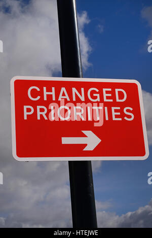 changed priorities road sign united kingdom Stock Photo - Alamy