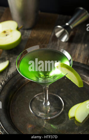 Homemade Green Alcoholic Appletini Cocktail with Apple Garnish Stock ...