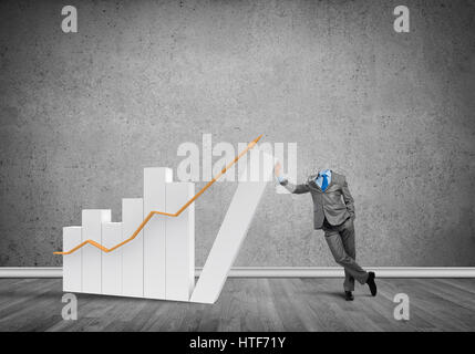 Headless businessman leaning on growing bar graph Stock Photo - Alamy