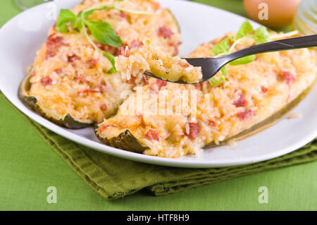 Stuffed zucchini halves Stock Photo - Alamy