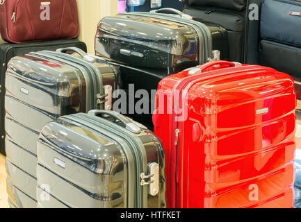 Sale of suitcases of different sizes and colors Stock Photo - Alamy