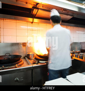 Crowded kitchen, a narrow aisle, working chef Stock Photo - Alamy