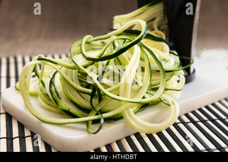 Preparing healthy spiral shredded zucchini squash Stock Photo - Alamy