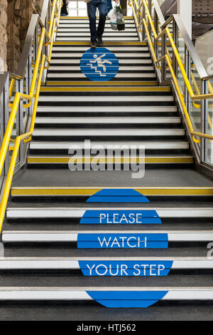 'Please watch your step' sign on steps. Safety advice for people to ...