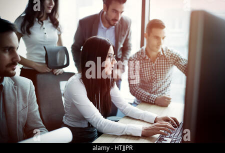 IT colleagues working on software developement project in office Stock ...