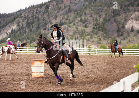 Cowgirls practicing barrel racing at the Richest Indian Rodeo. Merritt ...