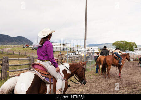 Cowgirls practicing barrel racing at the Richest Indian Rodeo. Merritt ...