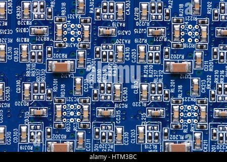 macro top view of a printed circuit board with processors, capacitors ...