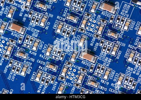 macro top view of a printed circuit board with processors, capacitors ...