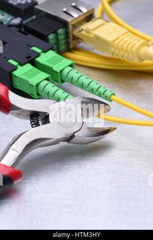 wire cutter cutting network cable from laptop on white background Stock ...