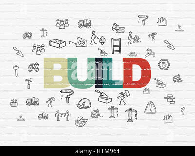 Constructing concept: Build on wall background Stock Photo - Alamy