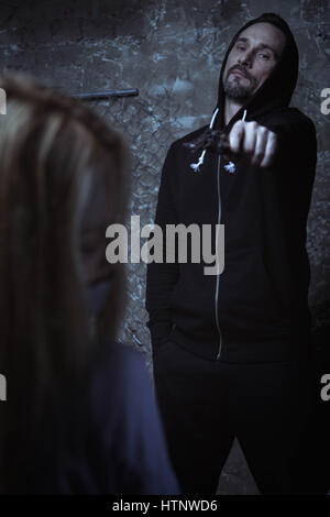 Selective of a gun pointing at the target Stock Photo - Alamy