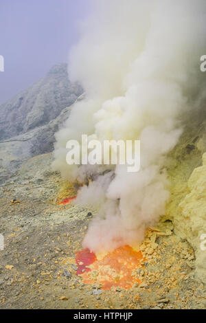Basket filled with sulfur at the open pit mine at Ijen Volcano in ...