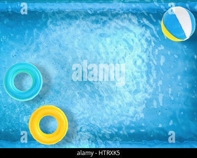 beach balls and swim rings floating on pool top view with blank space ...