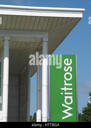 Waitrose opening hours sign Stock Photo - Alamy
