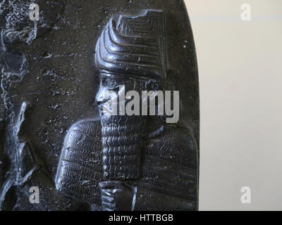 Mesopotamian stele, usurped by the Elamites. A god with orant (damaged ...