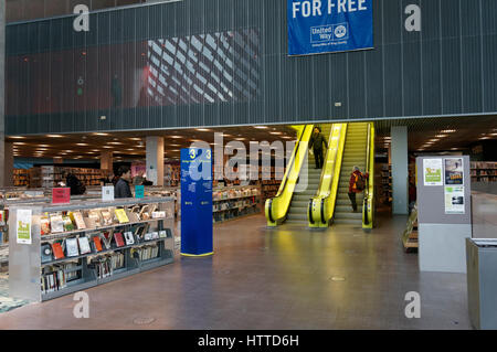 Book shelves and escalators in the Living Room on Level 3 of Seattle ...