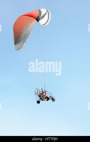 Paramotor in white sky Stock Photo - Alamy