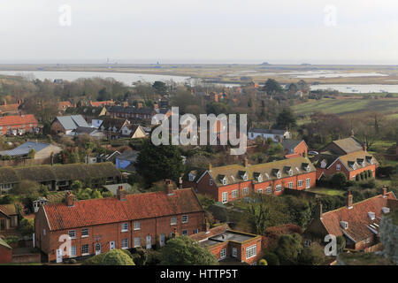 Orford Ness shingle spit view over rooftops of village houses, Orford ...