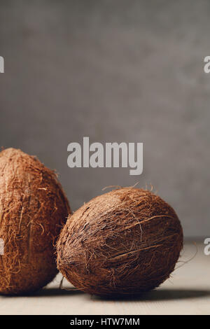 Whole unpeeled coconut Stock Photo - Alamy