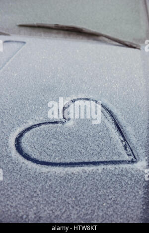 Heart symbol drawn on the snow, on winter day. Romance. Valentine's Day ...