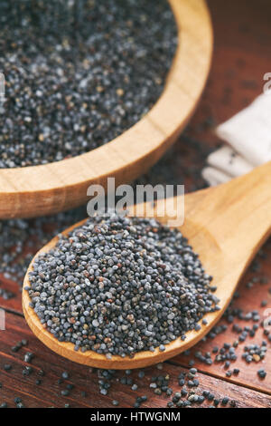 Poppy seeds in a wooden spoon Stock Photo - Alamy