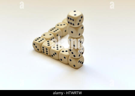 Optical illusion impossible triangle made with dice Stock Photo - Alamy
