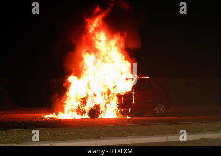 Car on fire, Car Explosion, Side View Stock Photo - Alamy