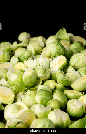Cut green cabbage on a black bowl Stock Photo - Alamy