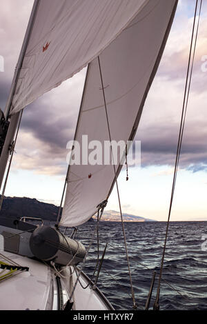 Yacht, Jib sail, rigging and sunset over the Mediterranean sea. View ...