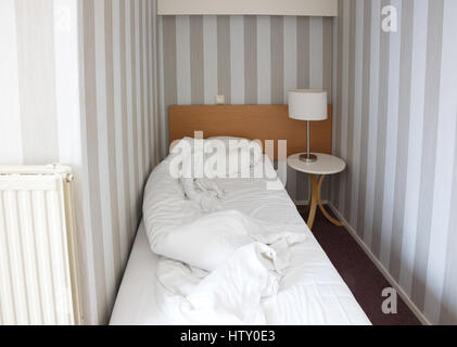 Simple small hotel room (classic), single bed Stock Photo - Alamy