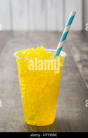 Yellow lemon slushie on rustic wood Stock Photo - Alamy