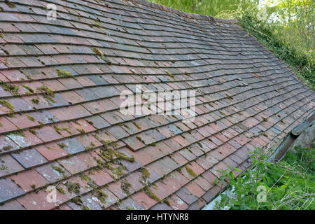 Diagonal line of the roof of a building. Many windows with heavy stone ...