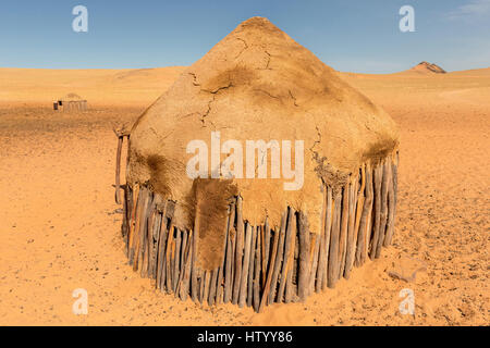 House of Himba tribe, in Kunene region, Namibia. Houses are made of ...