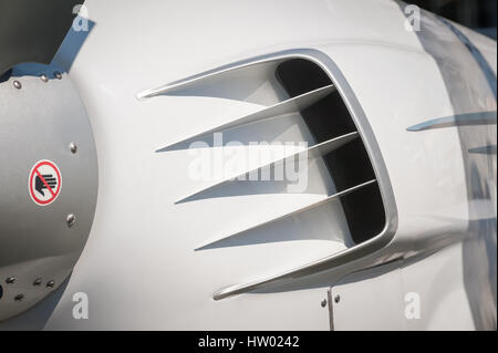 Warning sign on an aircraft engine about the hazardous areas around a ...