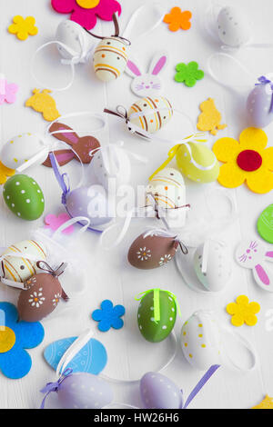 White eggs on paper with flower petals on stone background Stock Photo ...