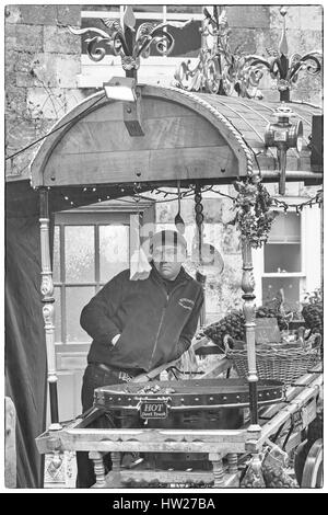 Winchester Christmas Market - Stall trader on costermonger cart selling ...