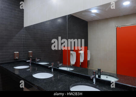 Modern Public Restroom with Sink, Urinal and Toilet Stock Photo - Alamy