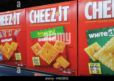 boxes of Cheez It brand snack crackers on the shelves of a grocery ...
